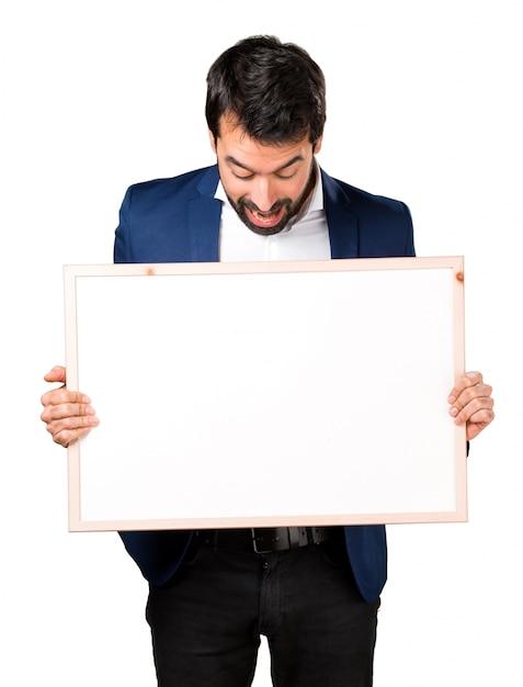 Free Photo Handsome Man Holding An Empty Placard