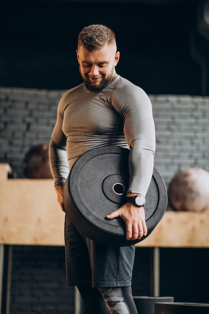 Free Photo | Handsome strong man exercising at the gym Free Photo | Handsome strong man exercising at the gym