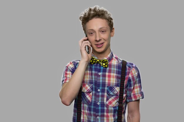 Premium Photo | Handsome teen boy talking on mobile phone. stylish ... Premium Photo | Handsome teen boy talking on mobile phone. stylish ...
