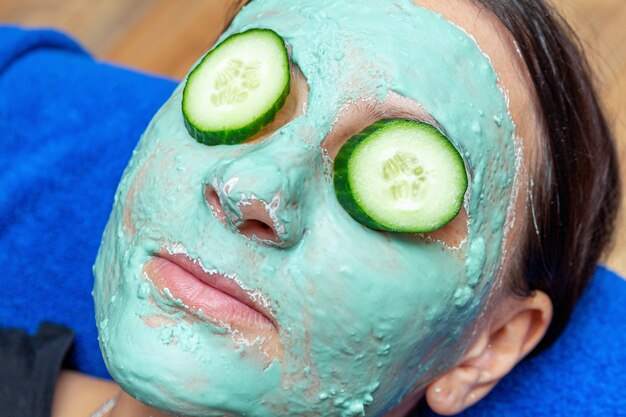 Premium Photo Happy Cheerful Girl With Freckles With A Green Cosmetic