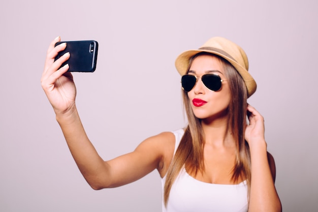 Free Photo Happy Cute Woman Making Selfie Isolated Over Gray Wall
