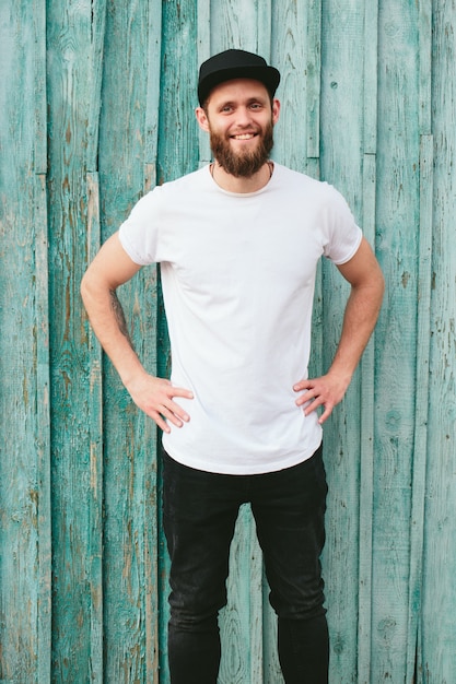 Premium Photo | Hipster handsome male model with beard wearing white ... Premium Photo | Hipster handsome male model with beard wearing white ...