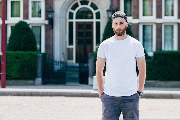 Premium Photo | Hipster handsome male model with beard wearing white ... Premium Photo | Hipster handsome male model with beard wearing white ...