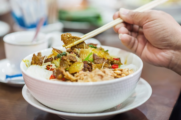 Premium Photo | Hold chopsticks of vietnamese grilled pork with rice ... Premium Photo | Hold chopsticks of vietnamese grilled pork with rice ...