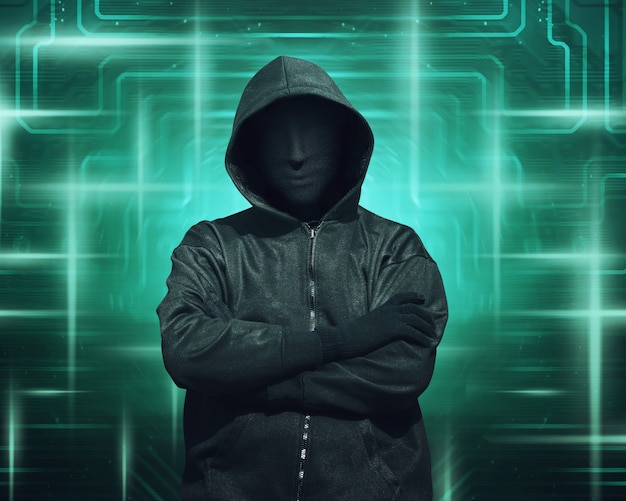Premium Photo | Hooded hacker with mask standing Premium Photo | Hooded hacker with mask standing