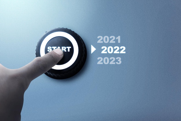 Premium Photo | A human hand pushes the start button to start 2022 ... Premium Photo | A human hand pushes the start button to start 2022 ...