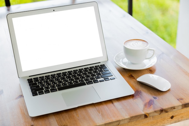 Free Photo | Laptop with a cup of coffee next Free Photo | Laptop with a cup of coffee next