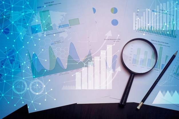 Premium Photo | Magnifying glass and documents with analytics data ... Premium Photo | Magnifying glass and documents with analytics data ...