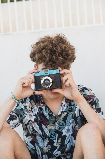 Free Photo | Man clicking photograph with camera Free Photo | Man clicking photograph with camera