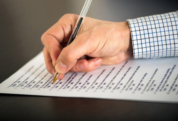 Premium Photo | Man completing a questionnaire Premium Photo | Man completing a questionnaire
