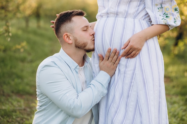 Premium Photo Man Is Kissing Pregnancy Belly Of His Wife