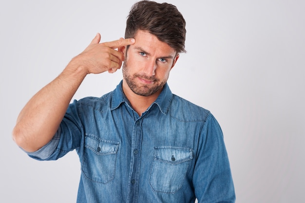Free Photo | Man pointing finger gun gesture to head Free Photo | Man pointing finger gun gesture to head