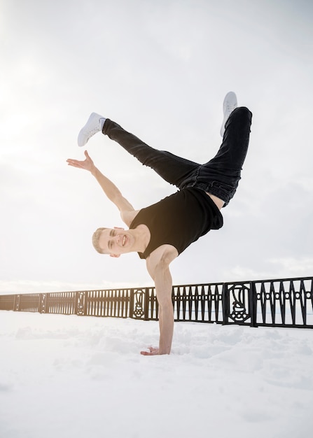 Free Photo | Man practicing hip hop outside in the snow Free Photo | Man practicing hip hop outside in the snow