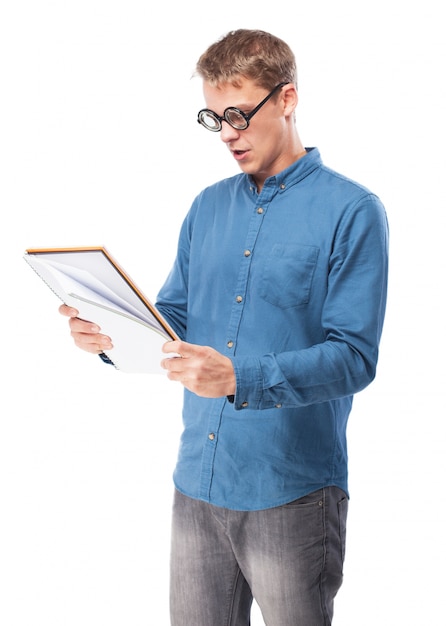 Free Photo Man With Glasses Looking At A Notebook