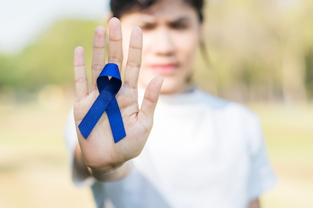 Premium Photo March Colorectal Cancer Awareness Month Woman Holding