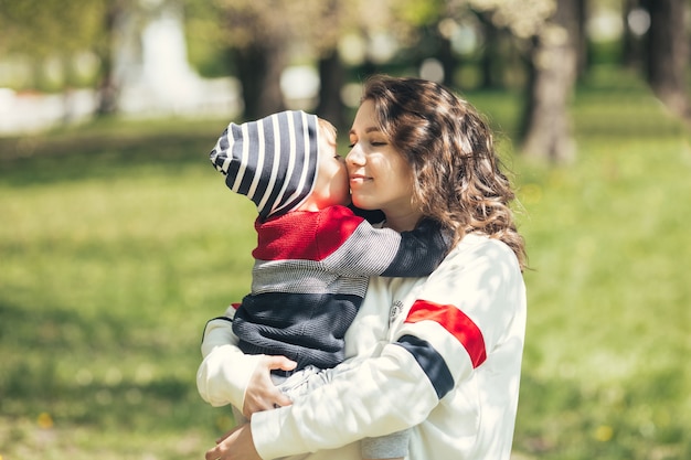 Premium Photo Mom Gently Hugs Her Son