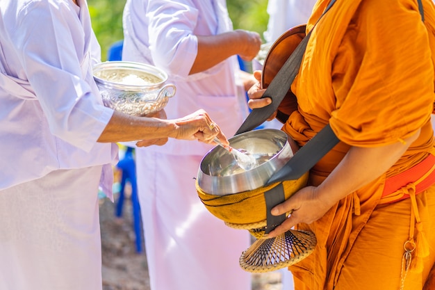Premium Photo | The monks of the buddhist sangha(give alms to a ... Premium Photo | The monks of the buddhist sangha(give alms to a ...