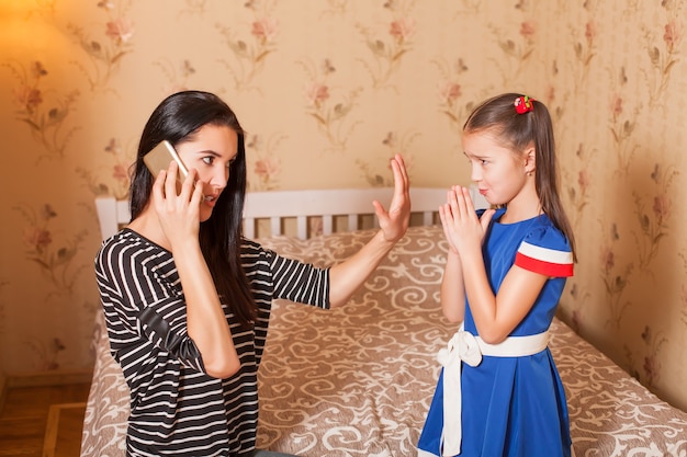 Premium Photo Mother Asks The Daughter To Keep Silent