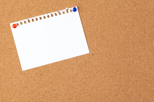 Premium Photo | Note paper pined on brown cork board Premium Photo | Note paper pined on brown cork board