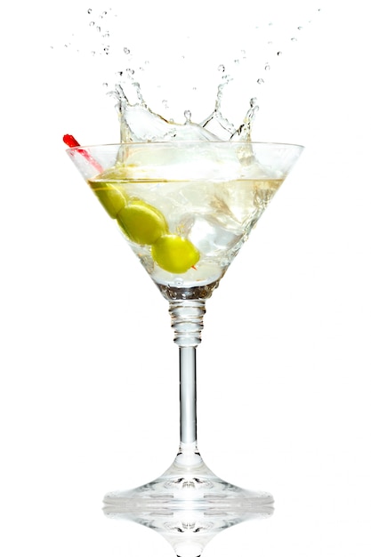 Olive Splashing On Martini Glass Isolated On White Premium Photo