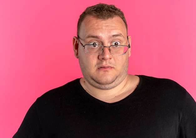 Free Photo Overweight Man In Glasses Wearing Black T Shirt Looking