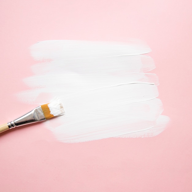 Free Photo | Paintbrush applying color on paper Free Photo | Paintbrush applying color on paper