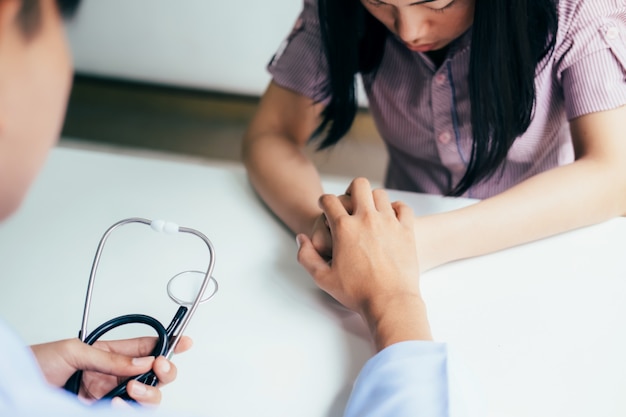 Premium Photo | Patient in the doctor office receiving bad news. Premium Photo | Patient in the doctor office receiving bad news.