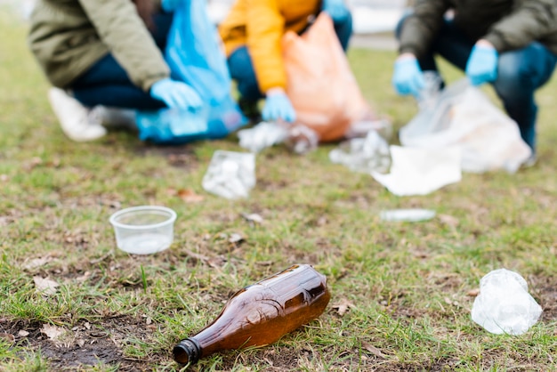 Free Photo | Plastic bottle on ground with defocused kids Free Photo | Plastic bottle on ground with defocused kids