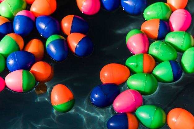 Free Photo | Plastic eggs floating in water Free Photo | Plastic eggs floating in water