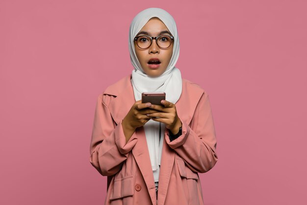 Premium Photo Portrait Of Amazed Beautiful Asian Woman Holding A