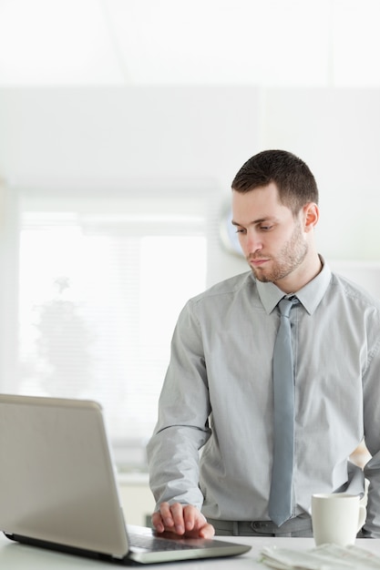 Premium Photo | Portrait of a businessman using a laptop Premium Photo | Portrait of a businessman using a laptop