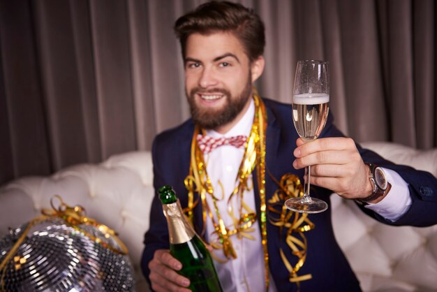 Free Photo | Portrait of cheerful businessman with champagne toasting Free Photo | Portrait of cheerful businessman with champagne toasting