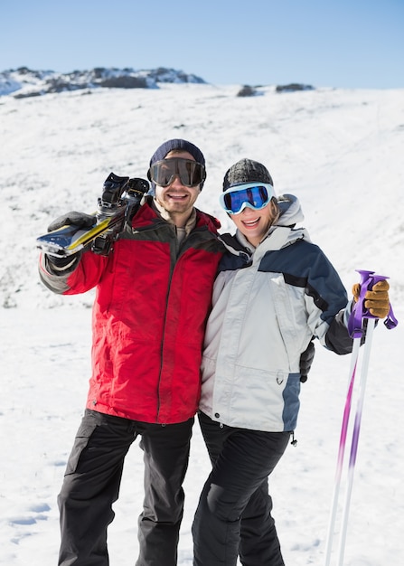 Premium Photo | Portrait of a cheerful couple with ski boards on snow Premium Photo | Portrait of a cheerful couple with ski boards on snow
