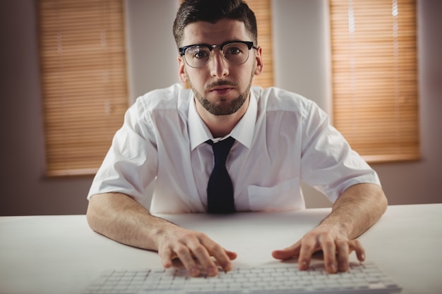 Premium Photo Portrait Of Man Wearing Eyeglass In Office