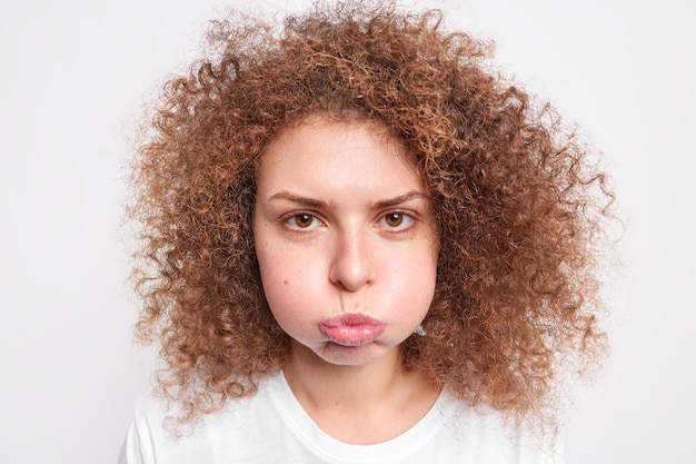 Premium Photo Portrait Of Offended Curly Haired Beautiful Young Woman
