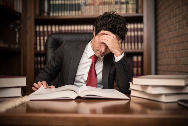 Premium Photo | Portrait of a tired businessman reading a book Premium Photo | Portrait of a tired businessman reading a book