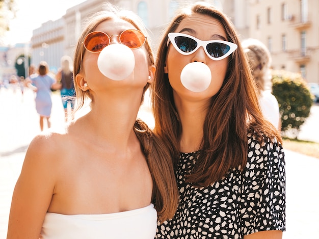 Free Photo | Portrait of two young beautiful smiling hipster girls in ... Free Photo | Portrait of two young beautiful smiling hipster girls in ...