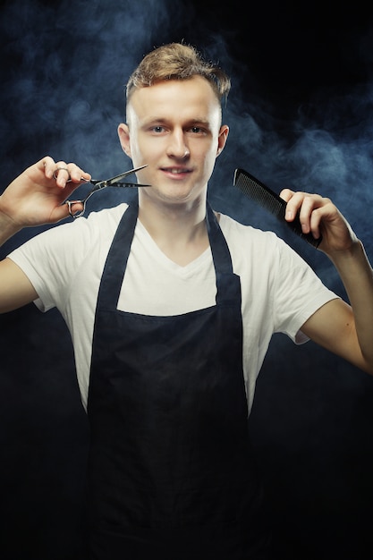 Premium Photo | Portrait of young hairstylist looking Premium Photo | Portrait of young hairstylist looking