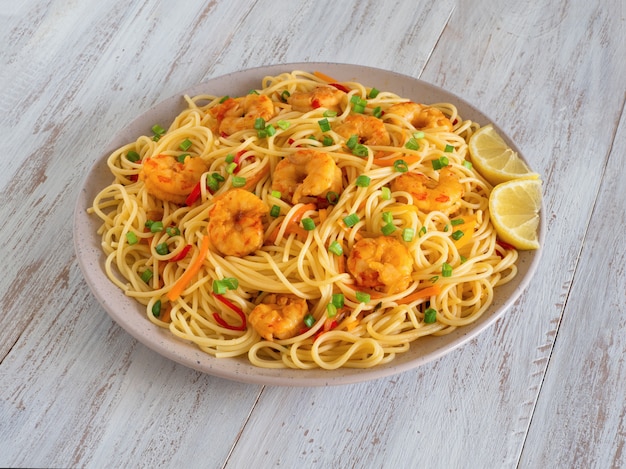 Premium Photo Prawn Schezwan Noodles With Vegetables In A Plate