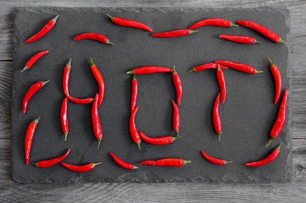 Premium Photo Red Hot Chili Peppers On Black Background