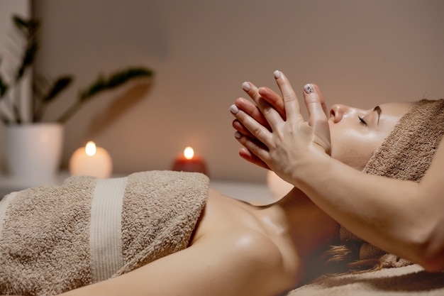 Premium Photo Relaxing Massage Woman Receiving Head Massage At Spa Salon