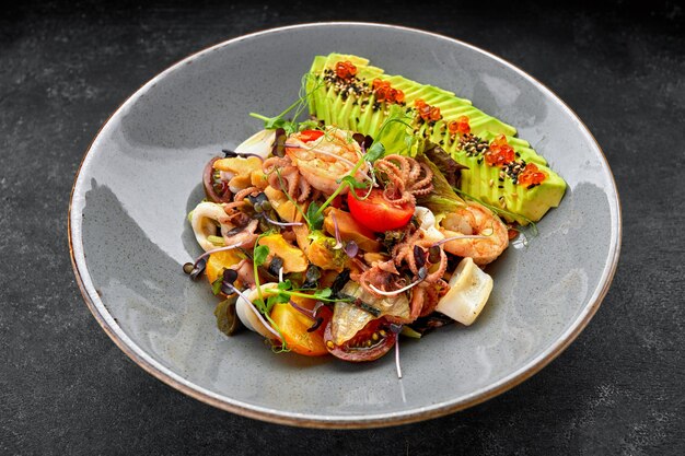 Premium Photo Seafood Salad With Avocado Shrimp Scallops Octopus