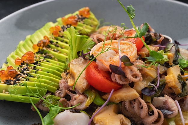 Premium Photo Seafood Salad With Avocado Shrimp Scallops Octopus