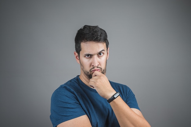 Premium Photo Serious Man With Intense Gaze Looking And Raising An