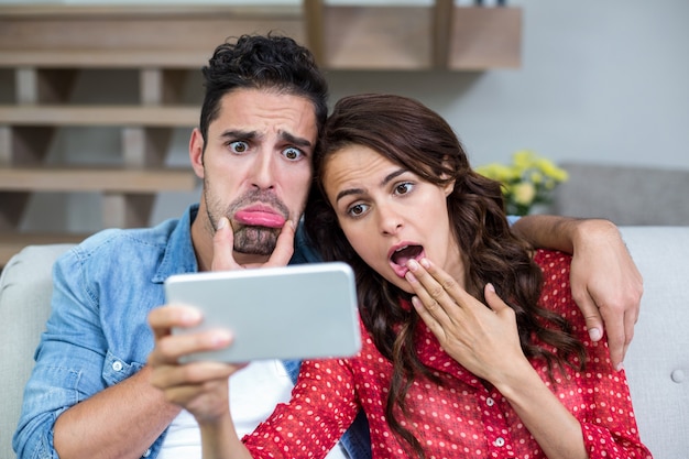 Premium Photo Shocked Couple Taking Self Portrait