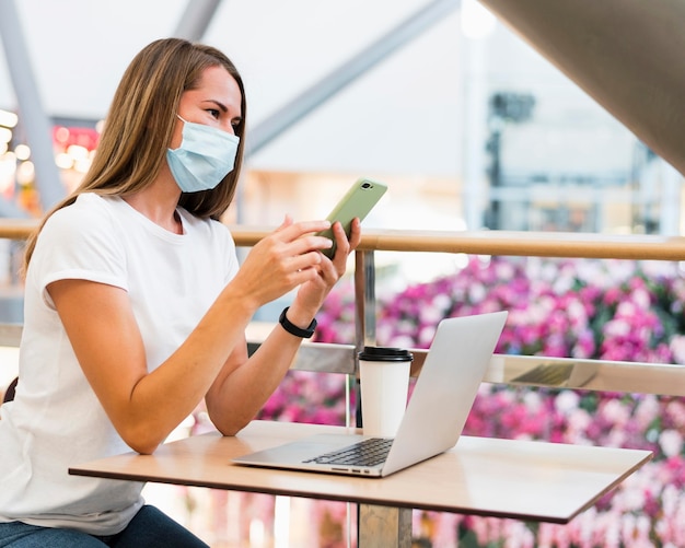 Free Photo | Side view young woman wearing face mask Free Photo | Side view young woman wearing face mask