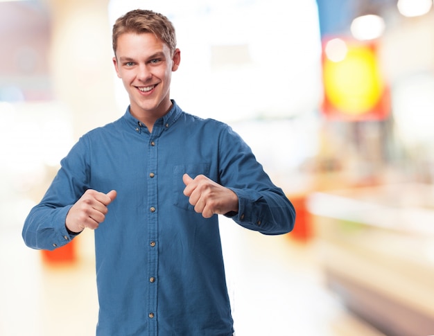 Smiling man pointing at himself with his thumbs Photo | Free Download Smiling man pointing at himself with his thumbs Photo | Free Download