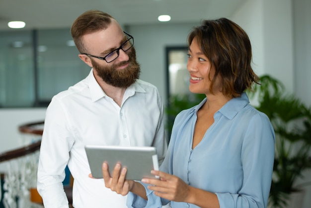 Free Photo | Smiling marketing specialists analyzing statistical data Free Photo | Smiling marketing specialists analyzing statistical data