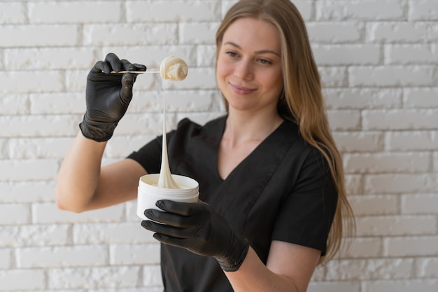 Premium Photo | Smiling professional beautician holding plastic bucket ... Premium Photo | Smiling professional beautician holding plastic bucket ...