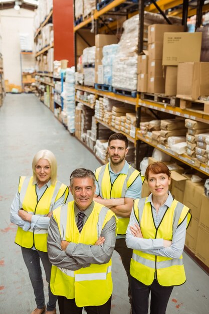 Premium Photo | Smiling warehouse team with arms crossed Premium Photo | Smiling warehouse team with arms crossed